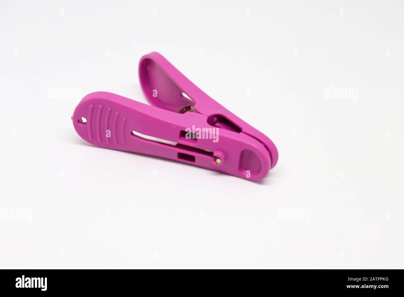 Pink plastic clothespins isolated on white background. Plastic clips ...