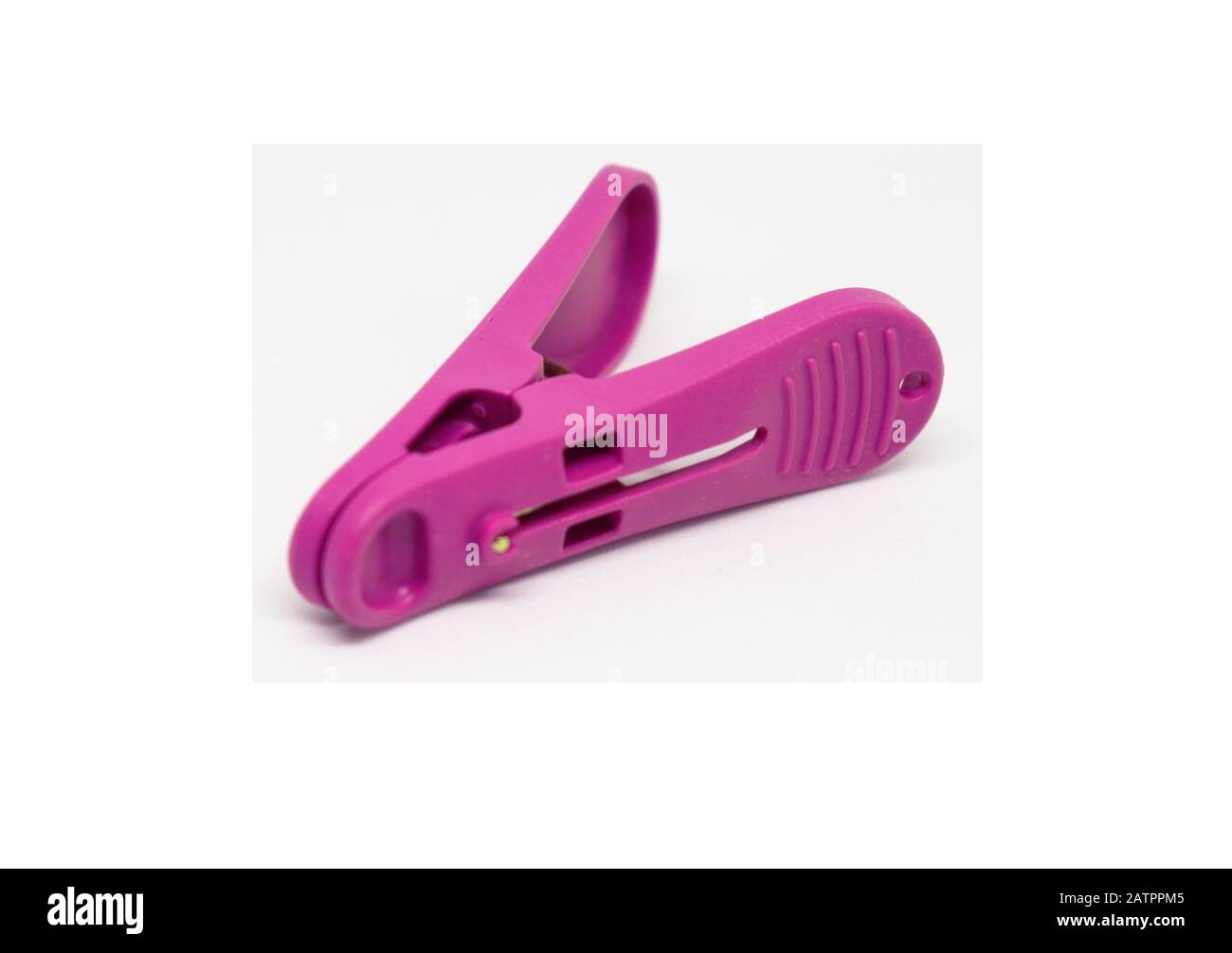 Pink plastic clothespins isolated on white background. Plastic clips ...