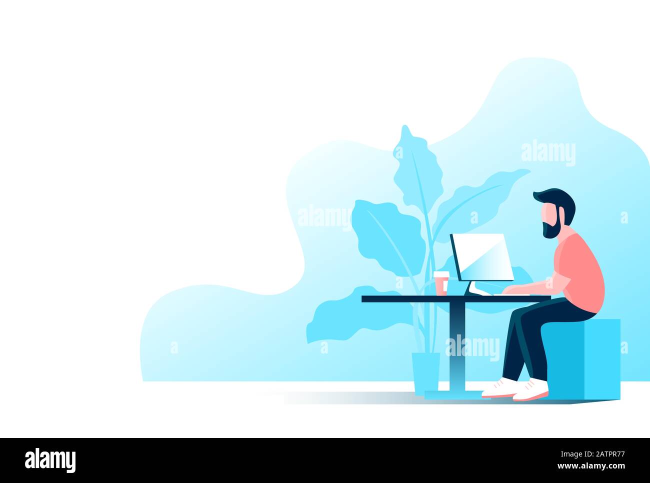 Young modern man with a beard works at the computer in the office. Sits ...