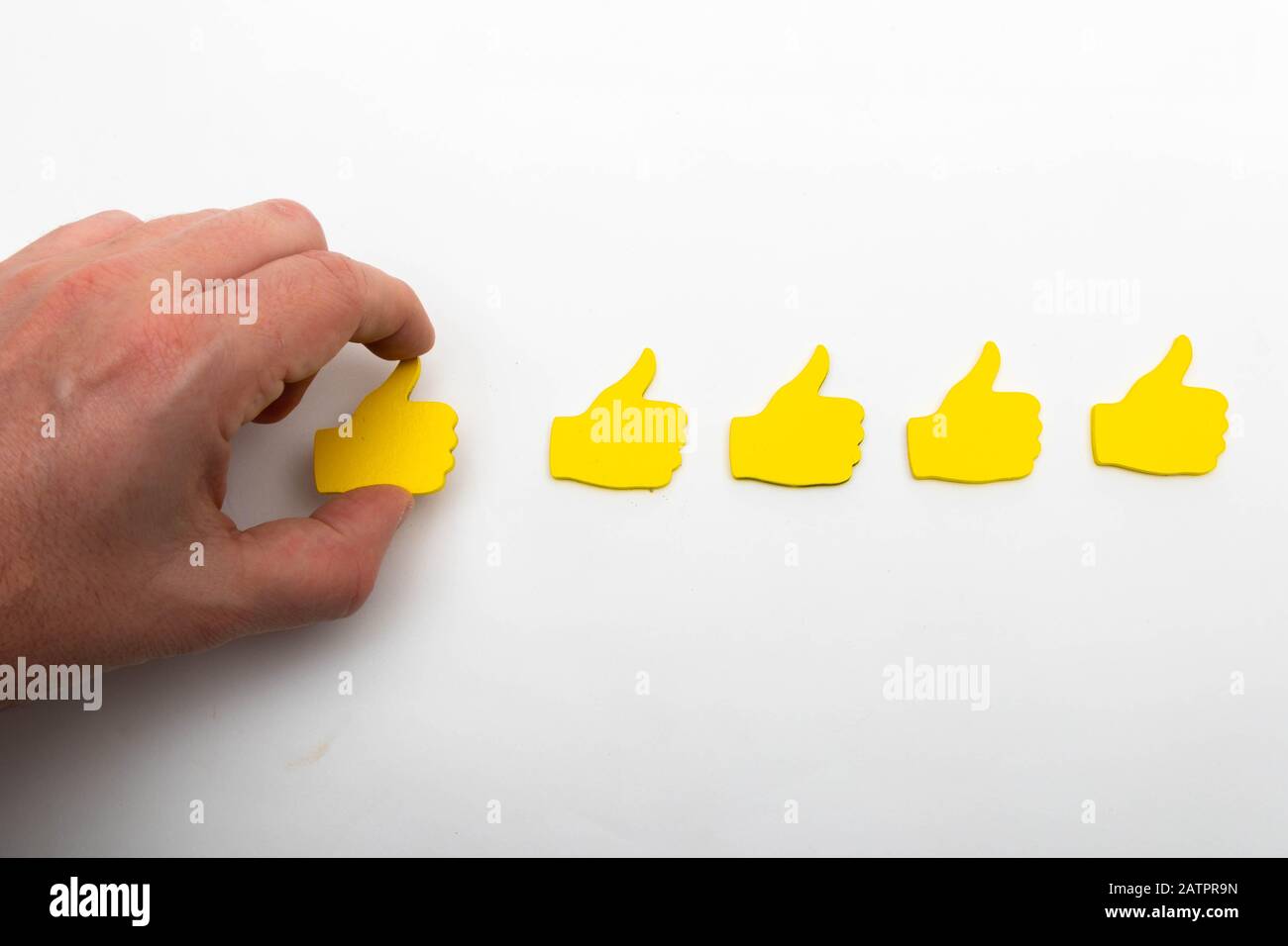 Customer feedback concept showing five yellow hands isolated on a plain ...