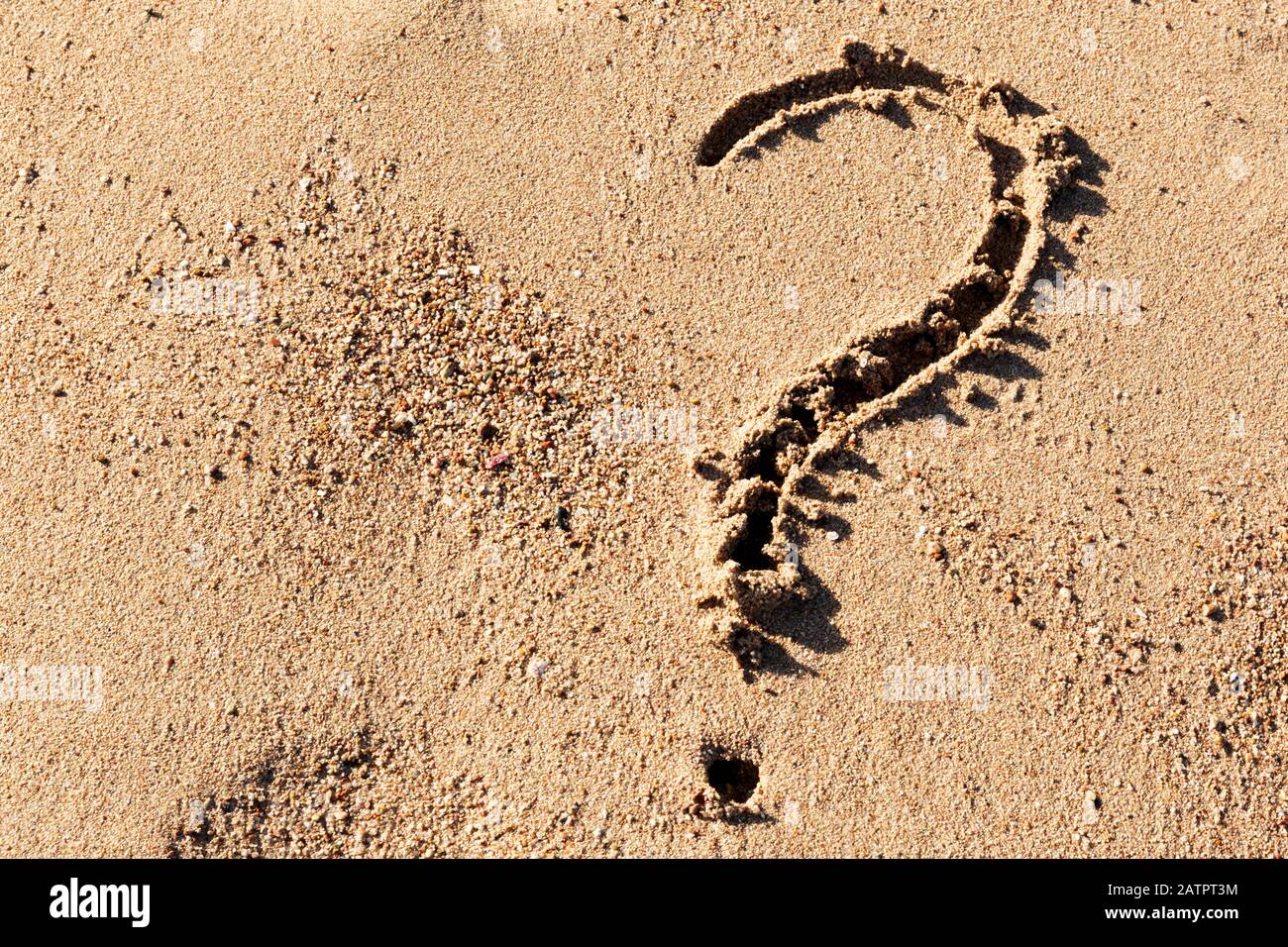 Question mark sign on sand beach near the sea. Concept of dilemma ...