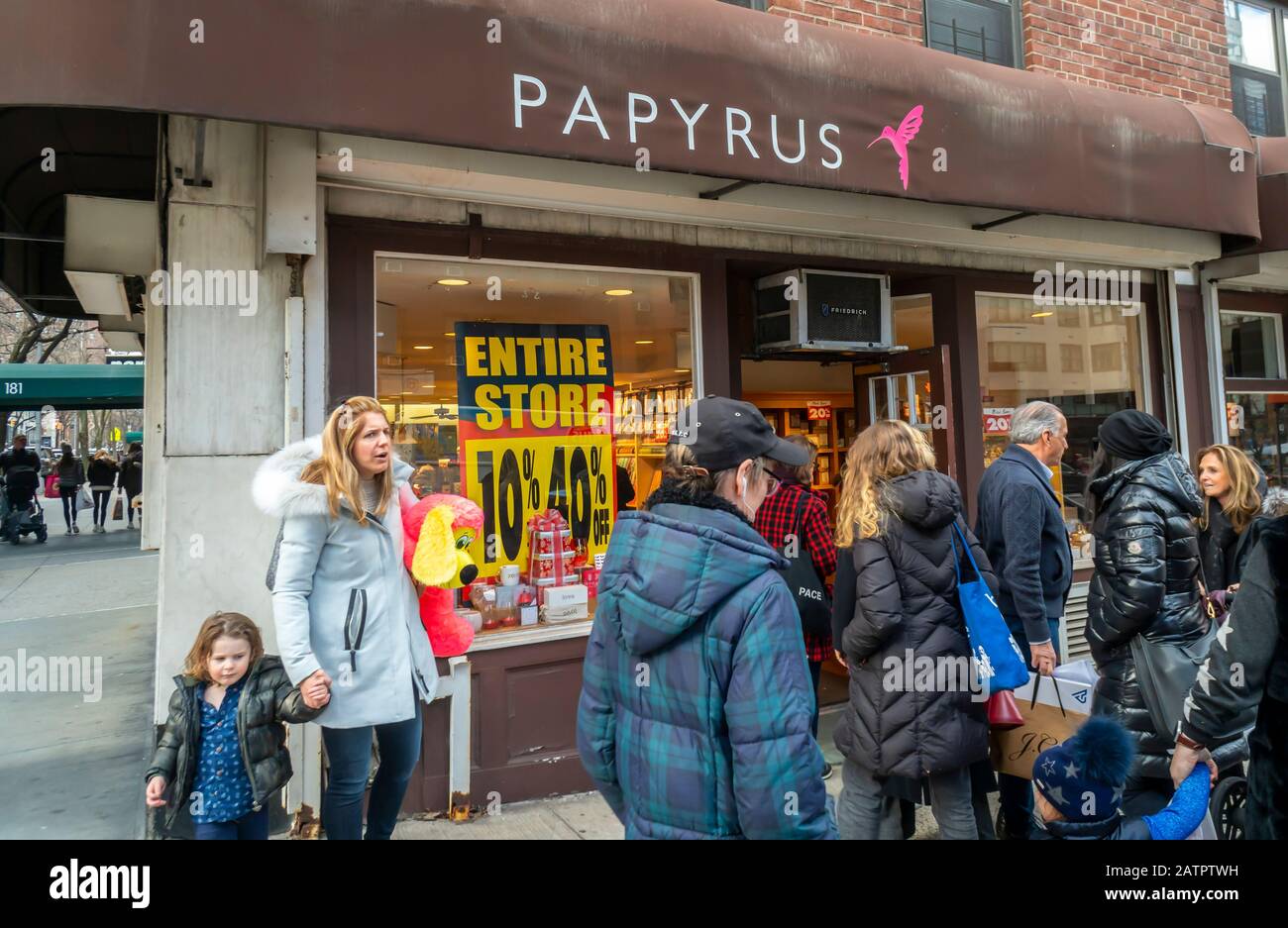 Customers outside a Papyrus store in the Upper East Side neighborhood ...