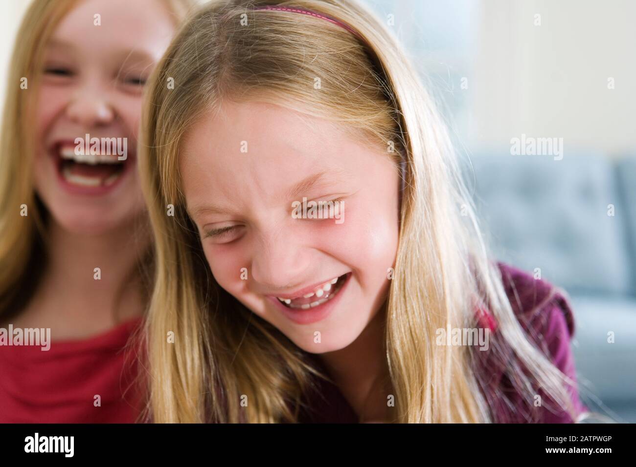 View of two girls laughing Stock Photo - Alamy