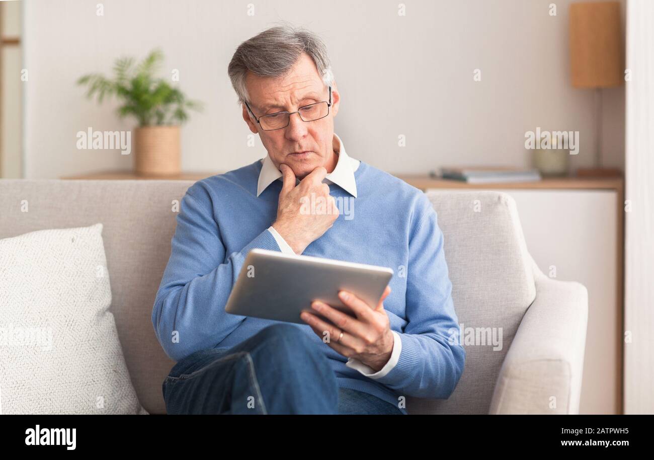 Serious elderly gentleman using hi-res stock photography and images - Alamy