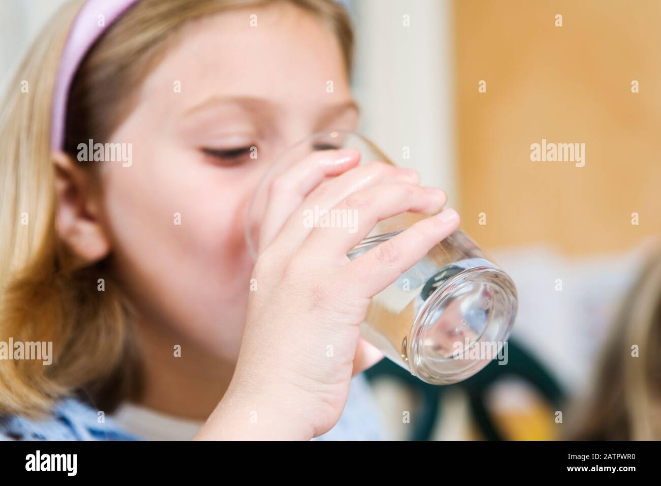 View of girl drinking water Stock Photo - Alamy
