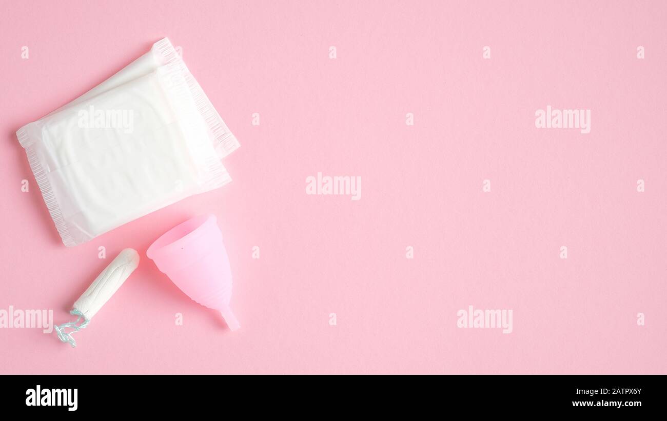 Menstrual hygiene products top view. Flat lay menstrual cup, sanitary ...