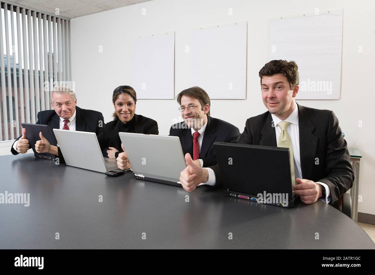Portrait of business people gesturing Stock Photo - Alamy