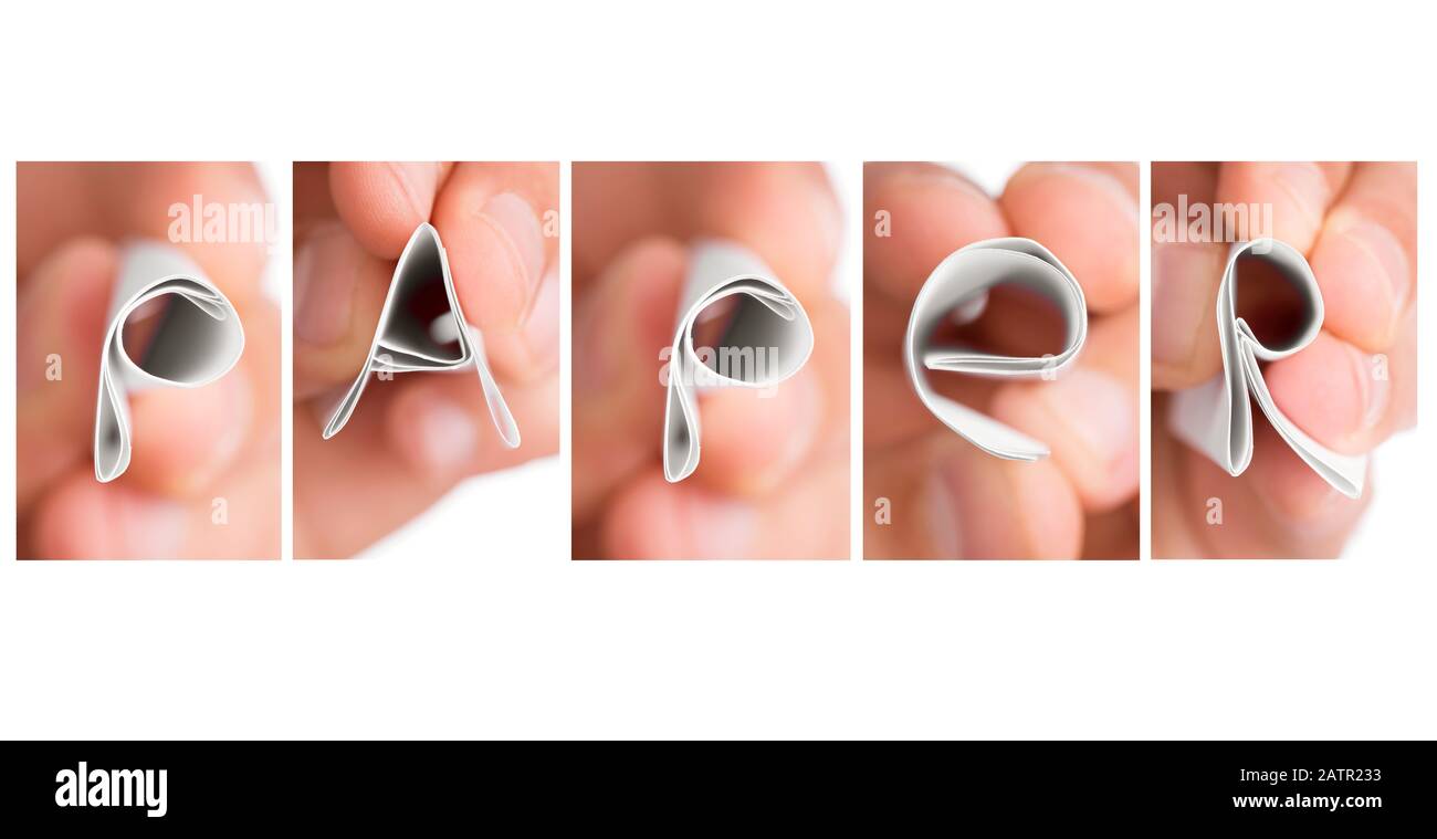 The word "paper" drawn up in the hands of paper letters. Concept photo ...