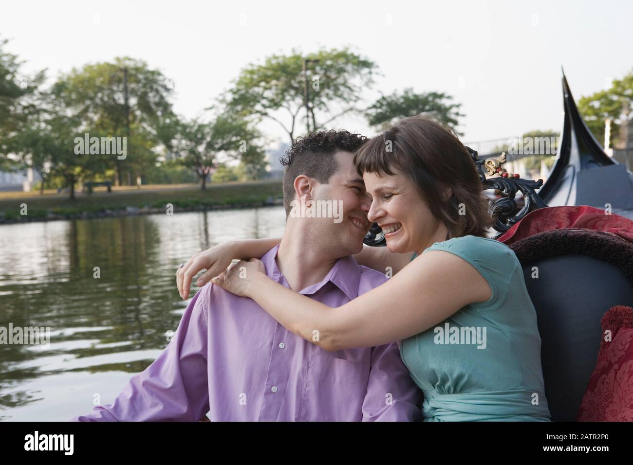 Mid adult couple romancing in a gondola Stock Photo - Alamy