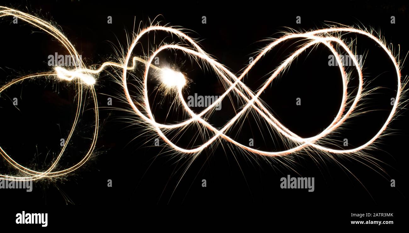 Playing with New Year firecrackers at night, dark background - 1/1/2020 ...