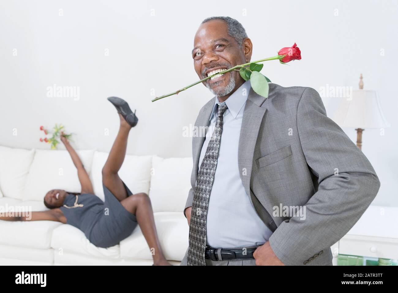 Woman holding rose between her teeth hi-res stock photography and ...