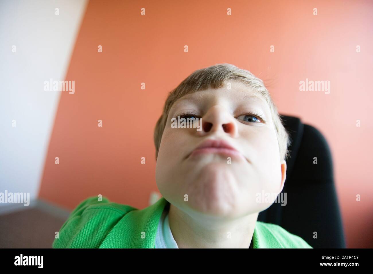 View of a boy making a funny face Stock Photo - Alamy
