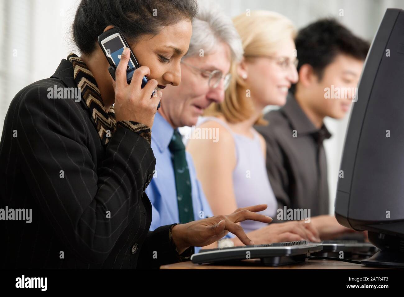View of professionals busy in work Stock Photo - Alamy