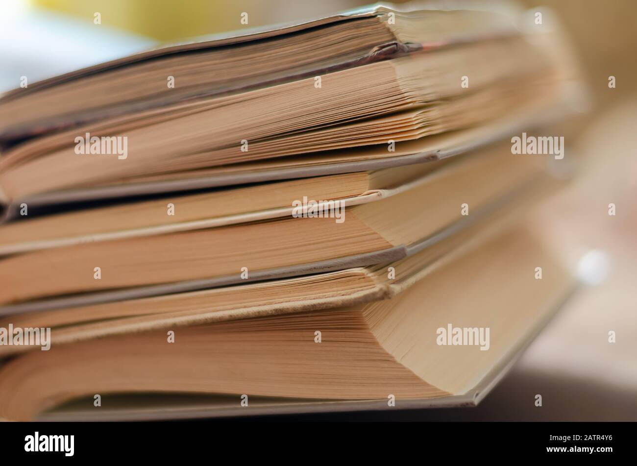 A close-up of the pages of a variety of hardback books. Preparation for ...