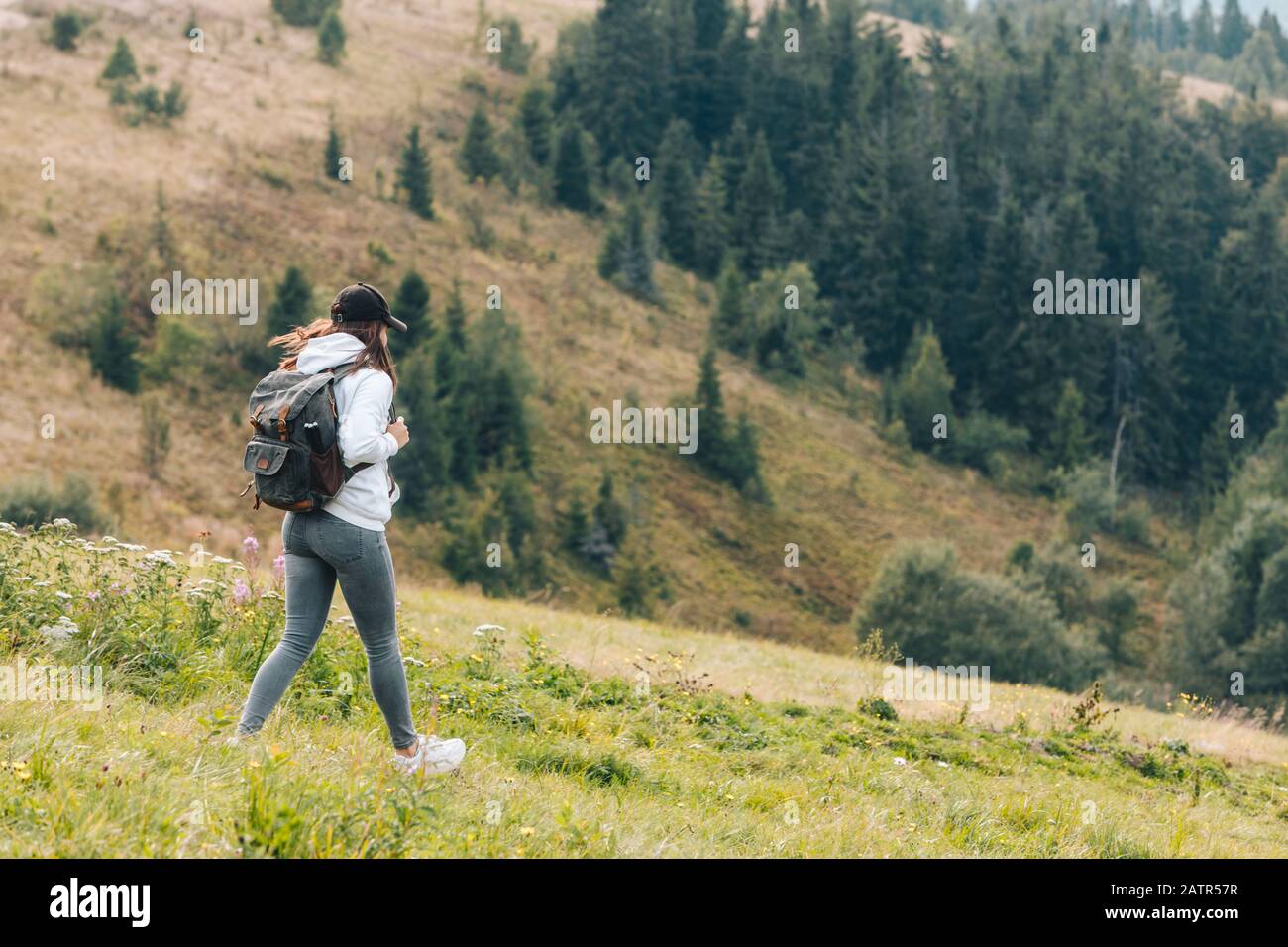 Stylish woman backpack hiking hi-res stock photography and images - Alamy