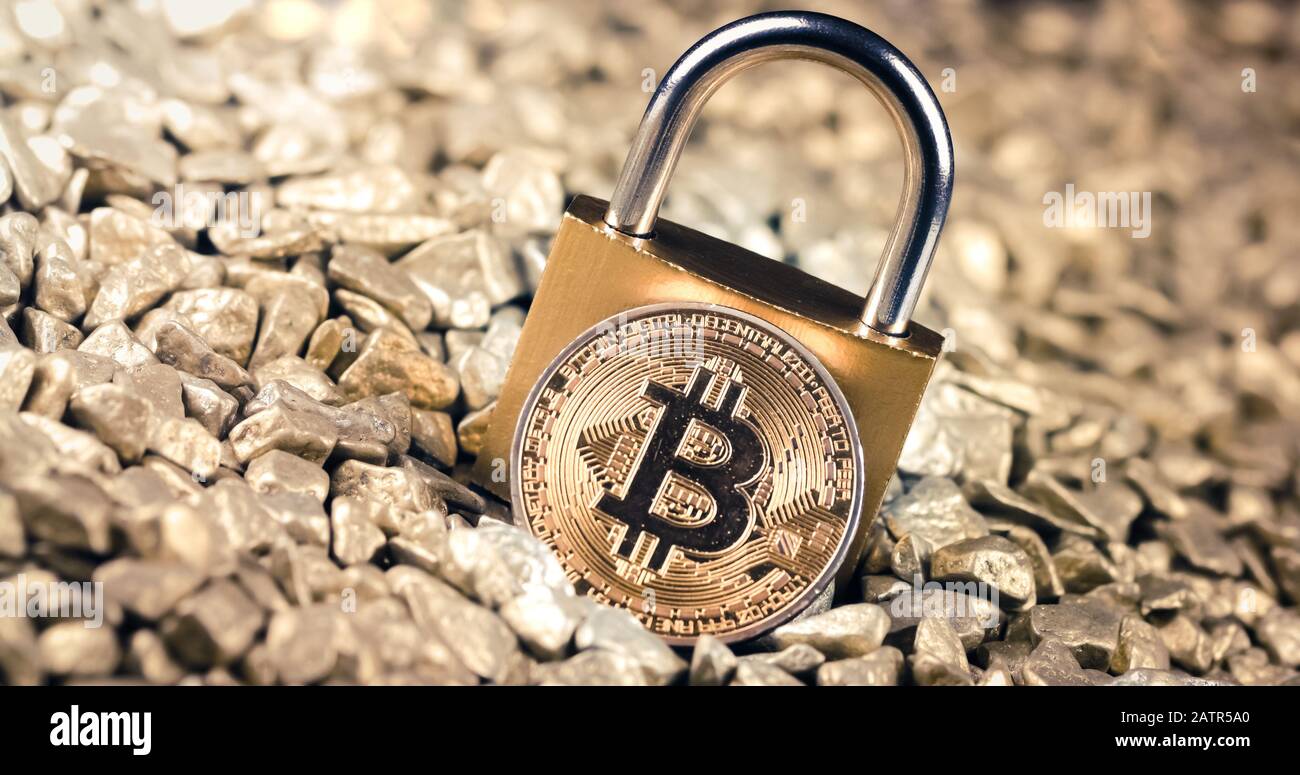 Bitcoin blockchain security concept with key lock on gold pile ...