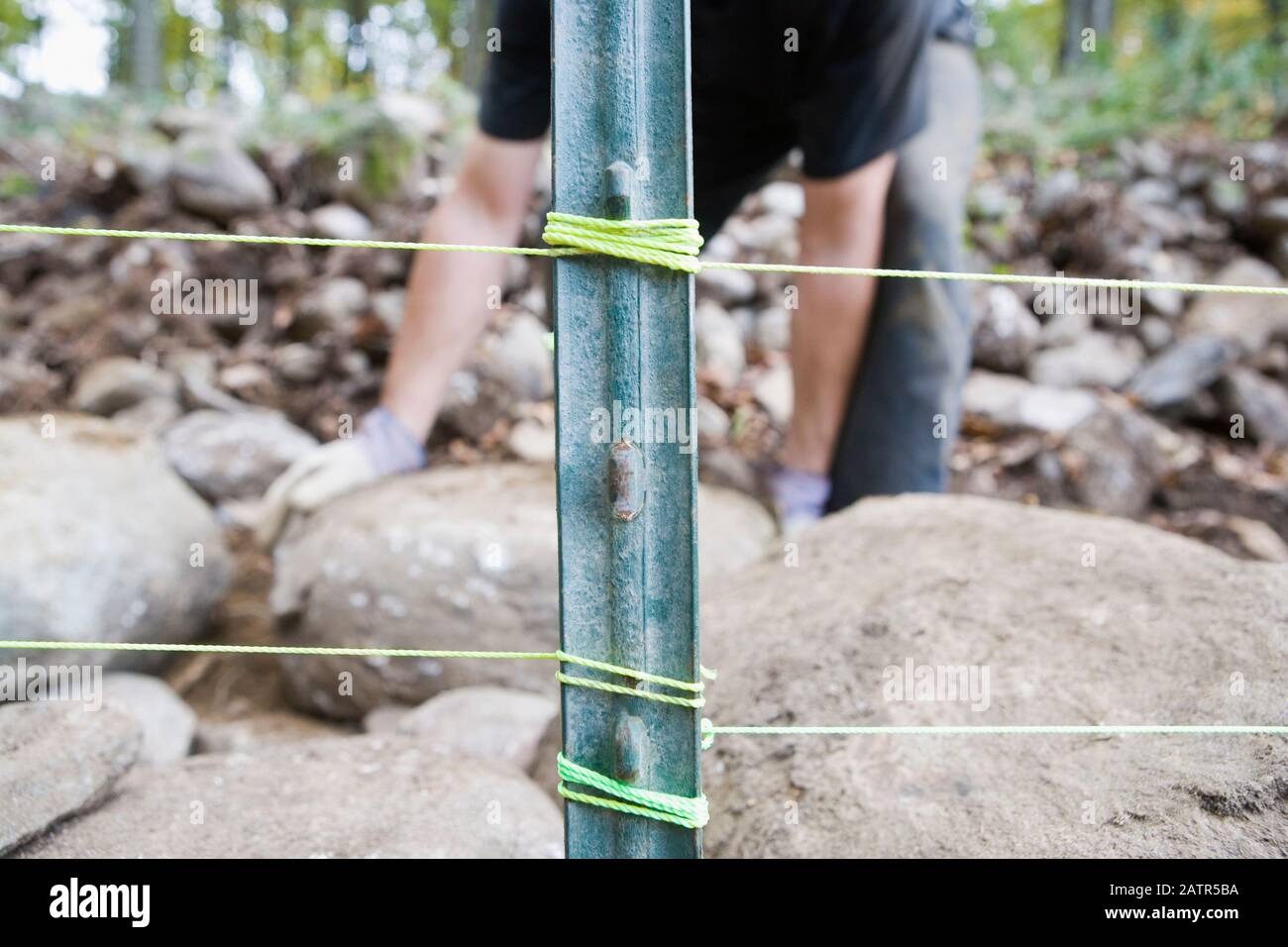 Rope tied up with pole Stock Photo - Alamy