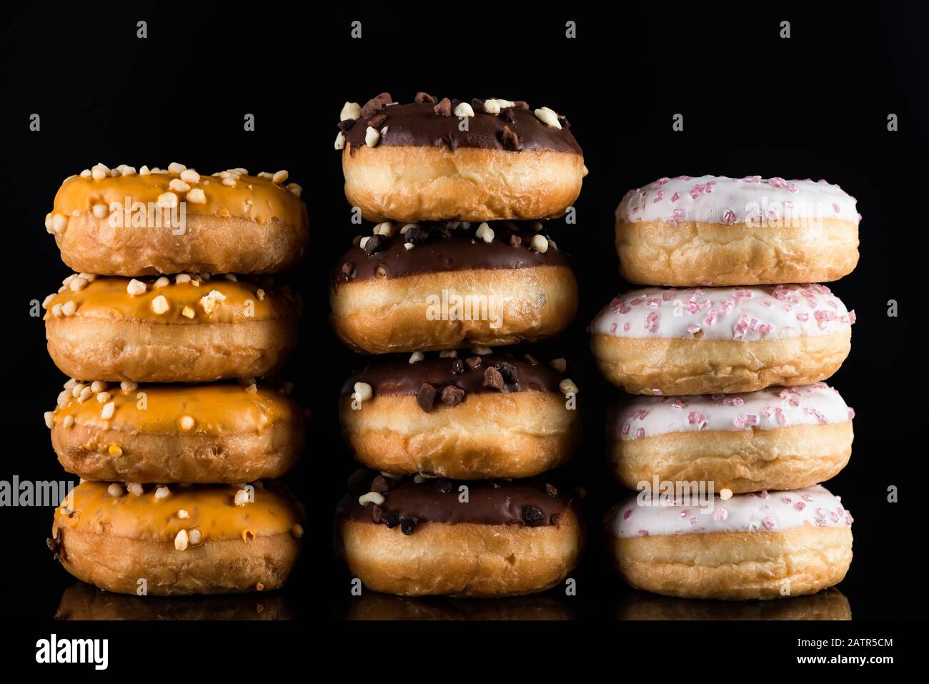 Donuts or Doughnuts Tower on Dark Background. Donut Stack Pile Food ...