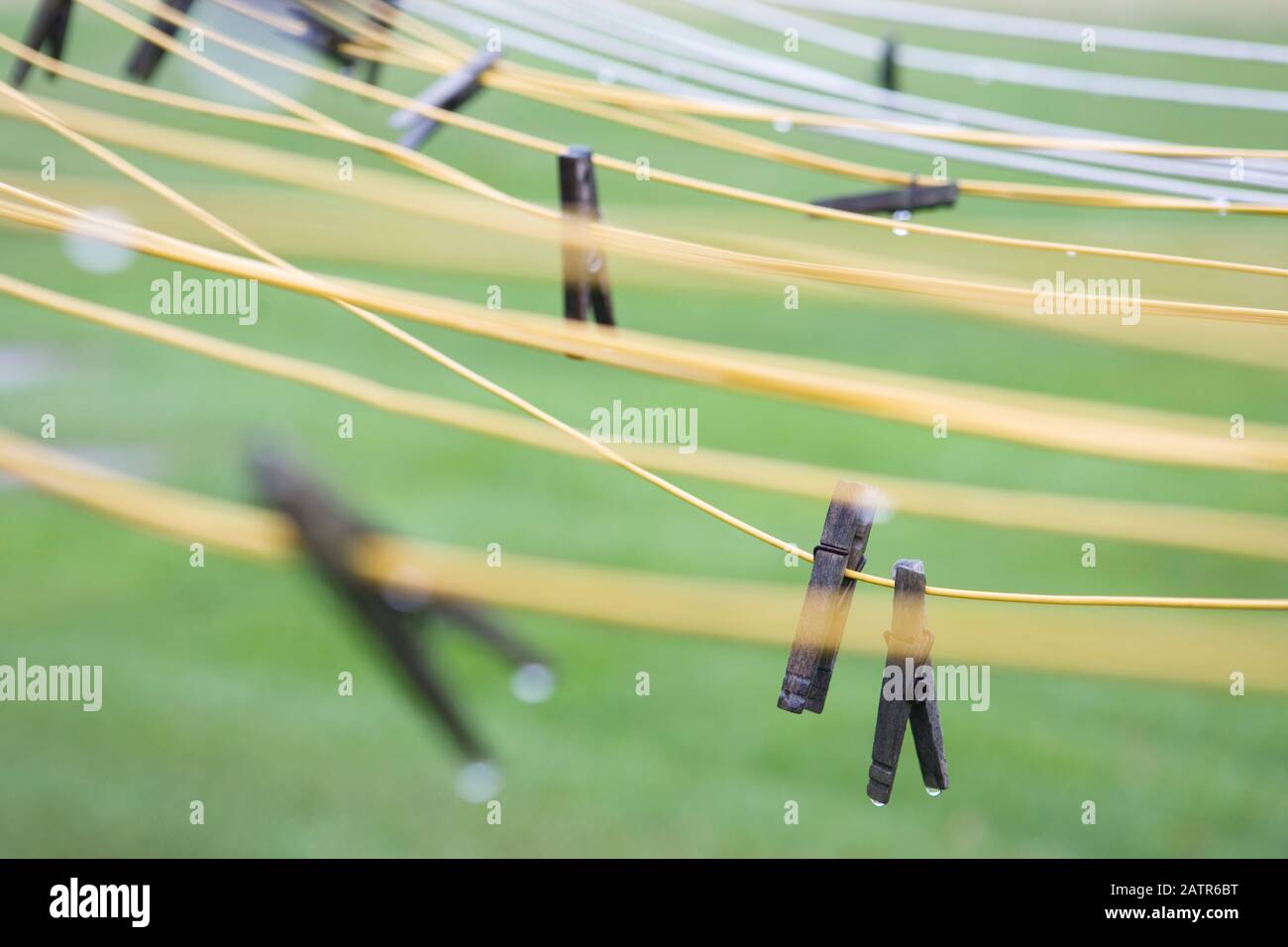 Wet clothes pins on clothes lines Stock Photo - Alamy