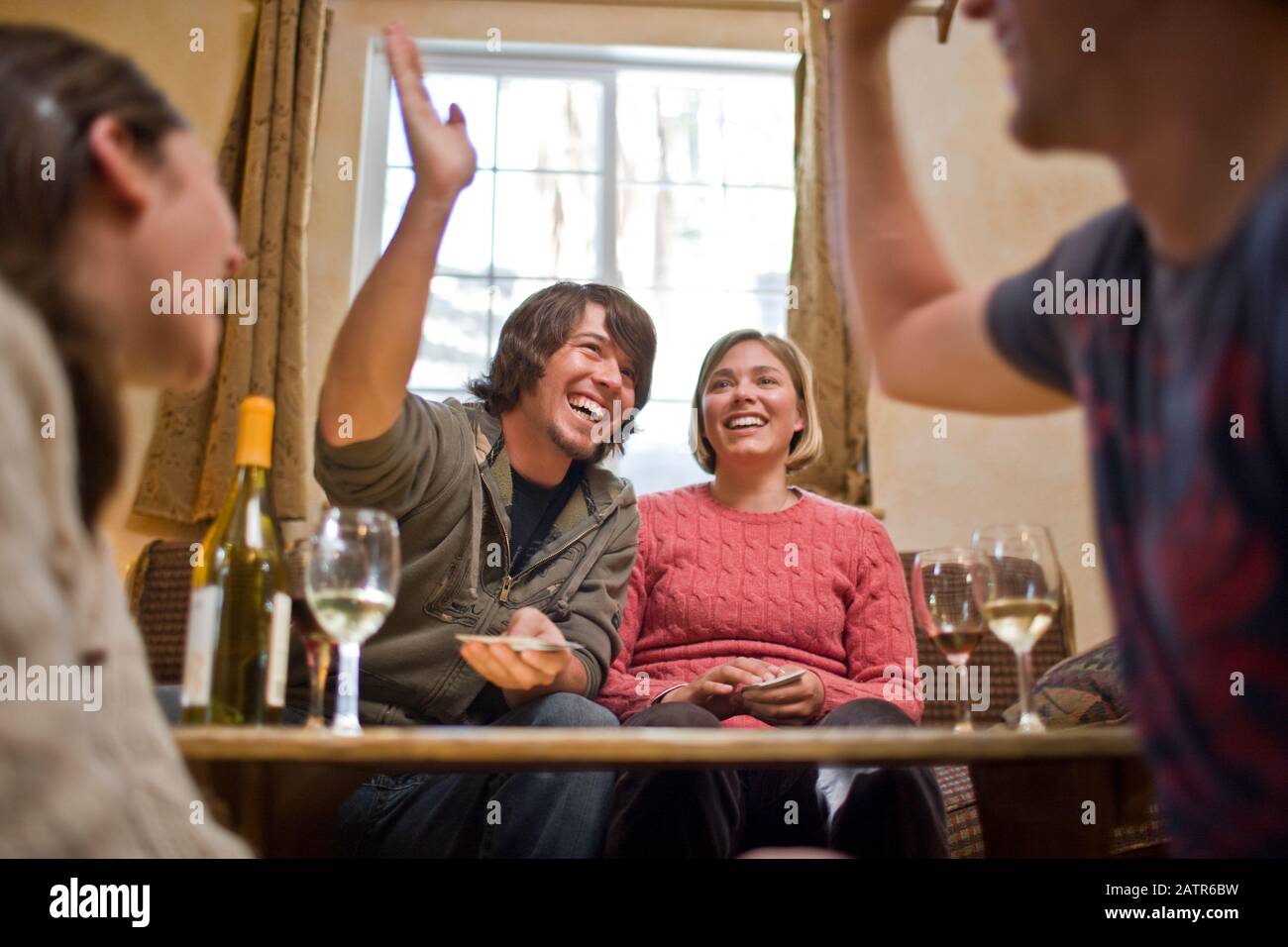 Group of friends playing cards Stock Photo - Alamy