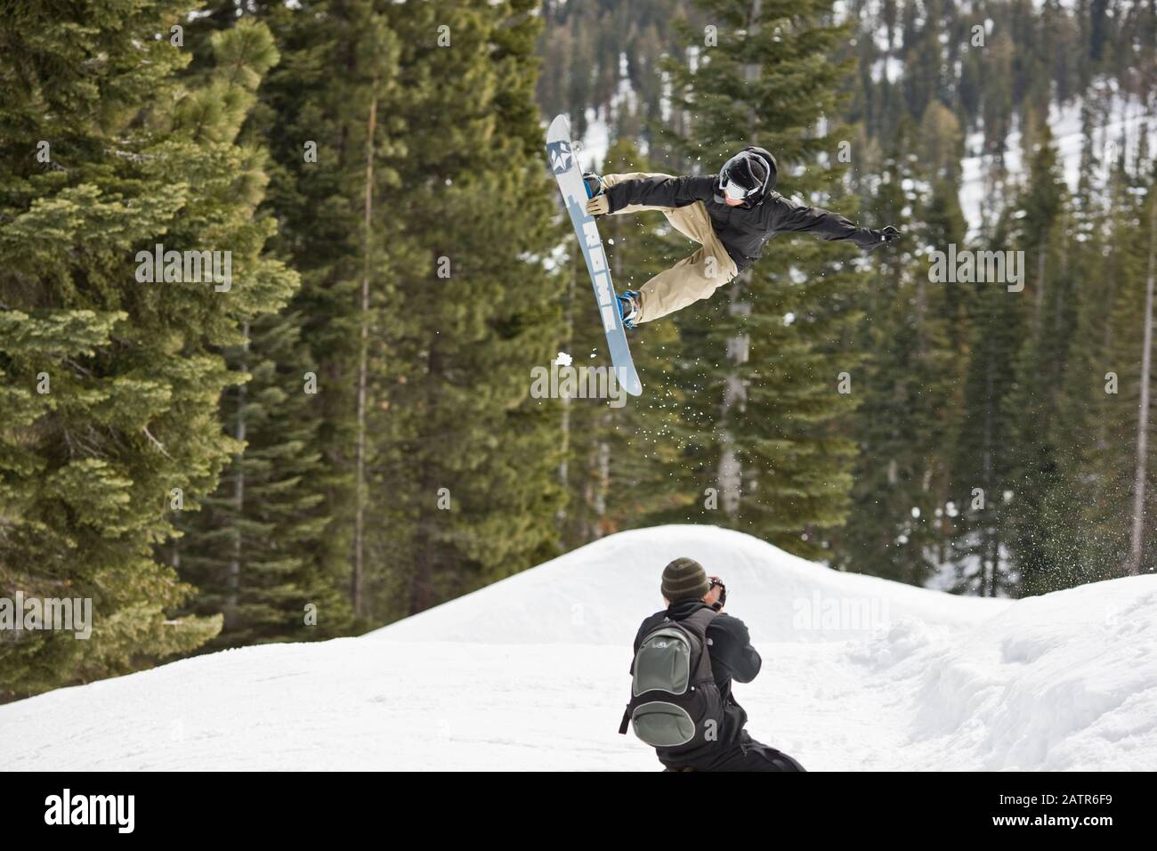 Man snowboarding in mid-air Stock Photo - Alamy