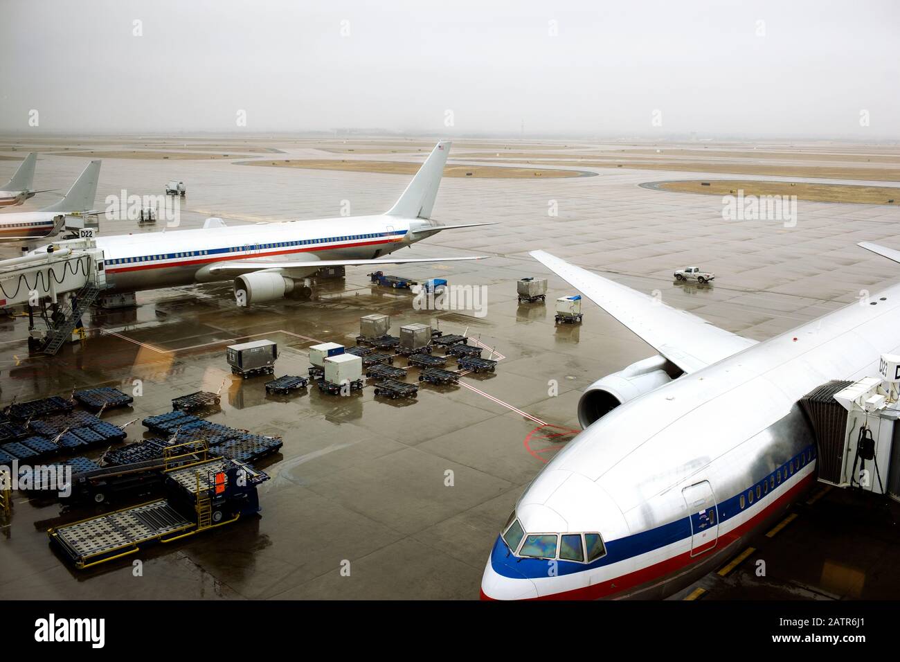 Airplanes being loaded up on the tarmac before takeoff Stock Photo - Alamy