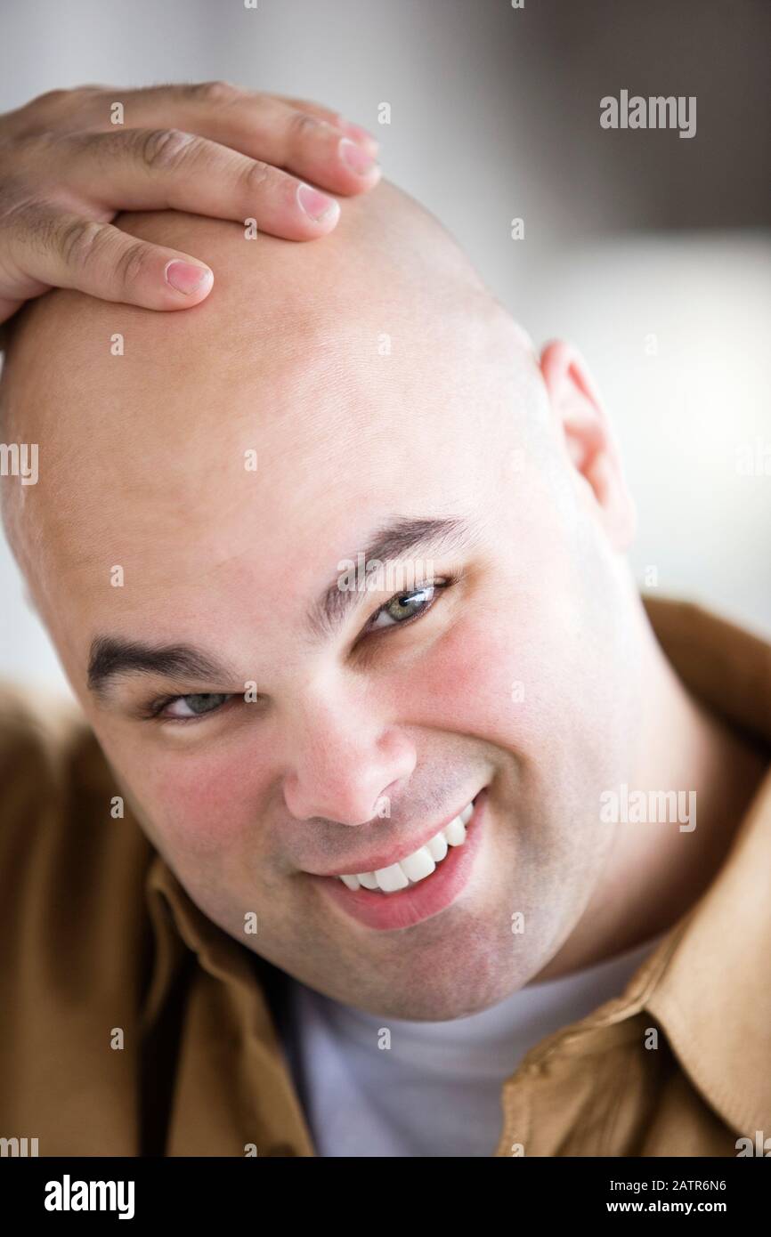 Portrait of a bald headed man smiling Stock Photo - Alamy