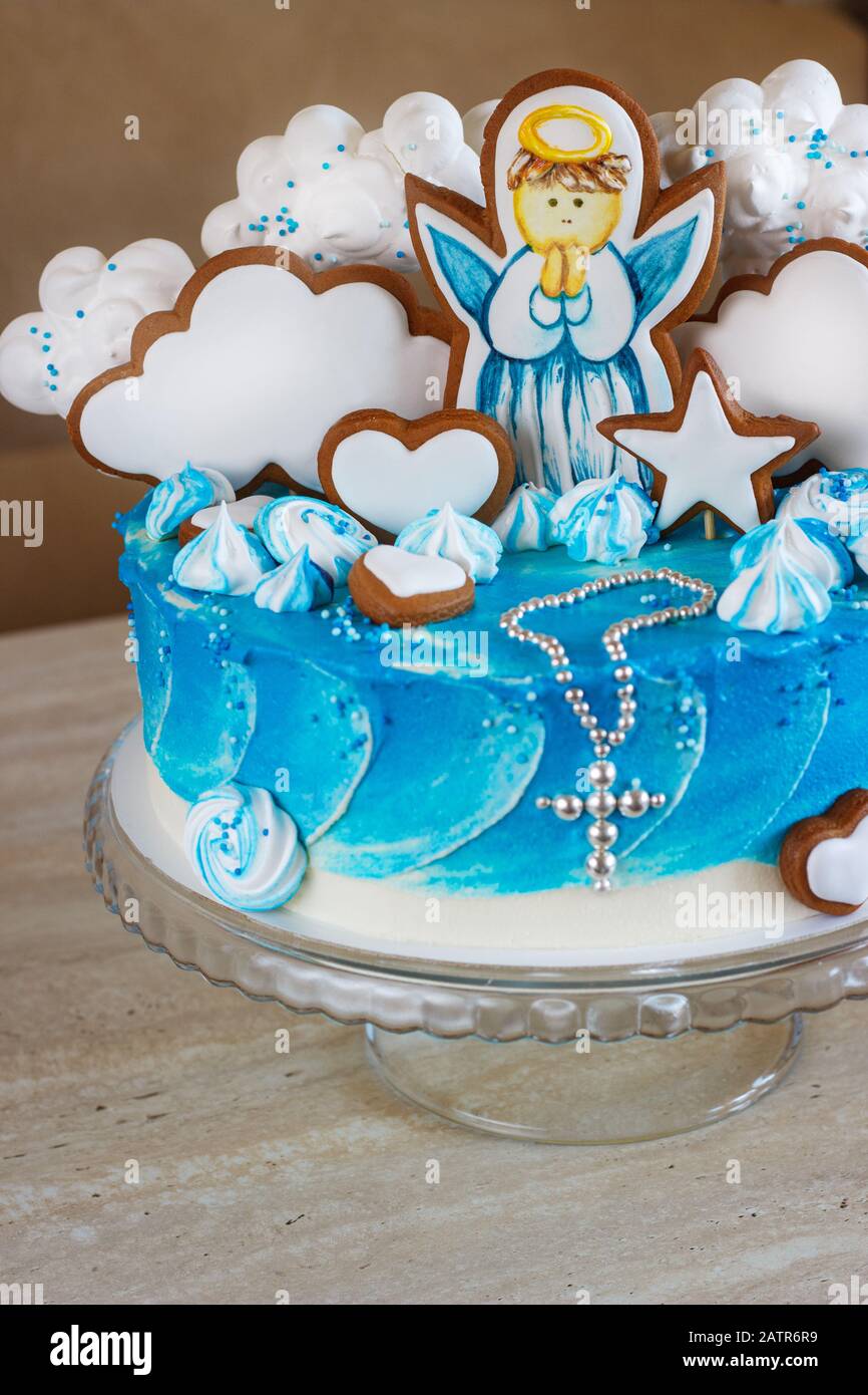 blue baptism cake with an angel on a gingerbread Stock Photo - Alamy