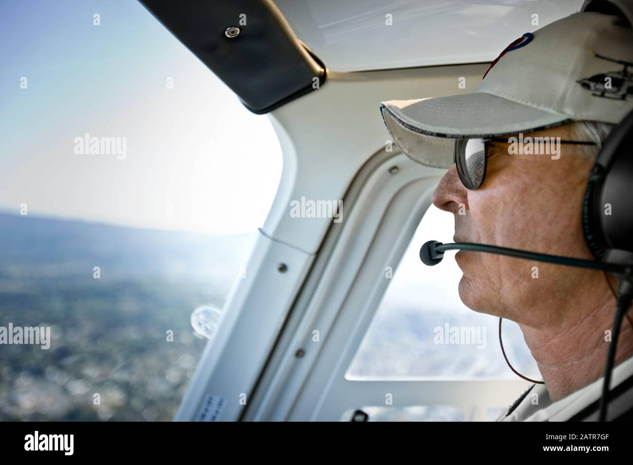 Pilot flying a plane Stock Photo - Alamy