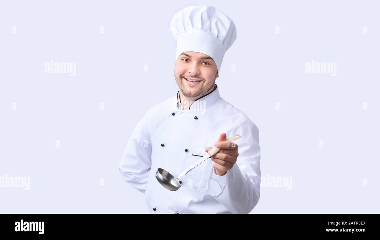 Happy Cook Posing With Ladle Soup Spoon, Studio Shot, Panorama Stock ...