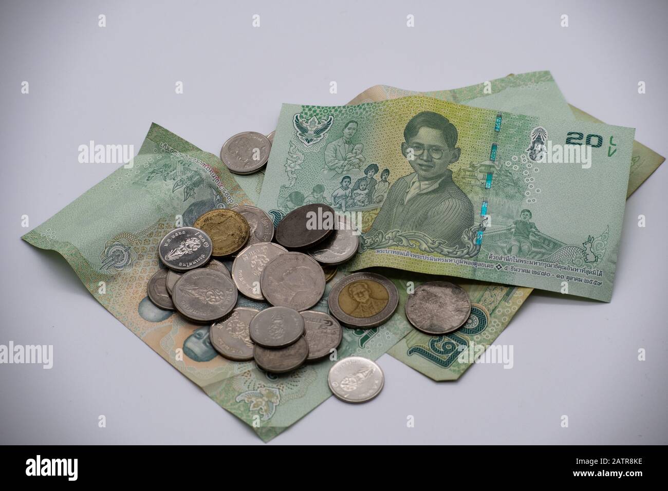 hai currency mixed from bills and coins with white background Stock ...