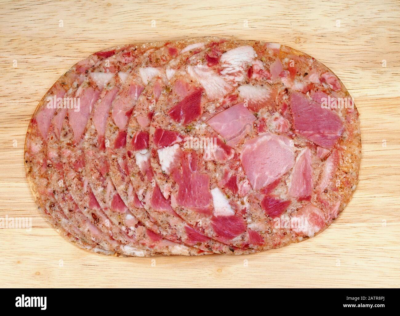 Brawn sausage sliced on a wooden plate Stock Photo - Alamy