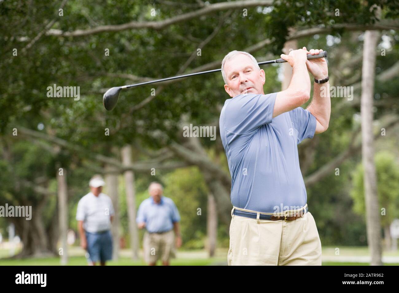 Senior man playing golf Stock Photo - Alamy