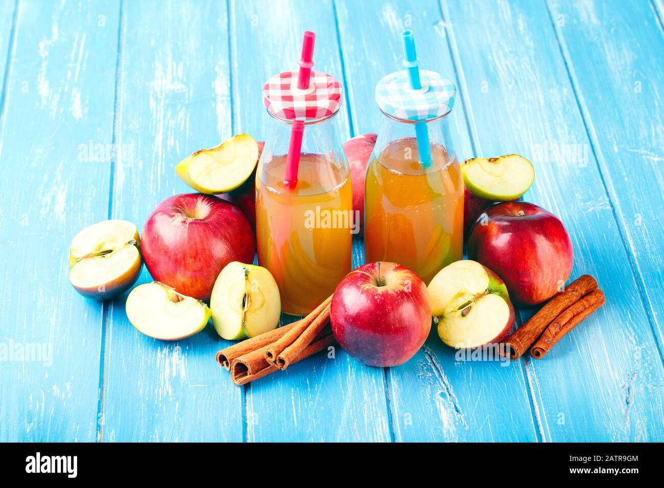 Two bottle fresh organic apple cider or apple juice with with cinnamon ...