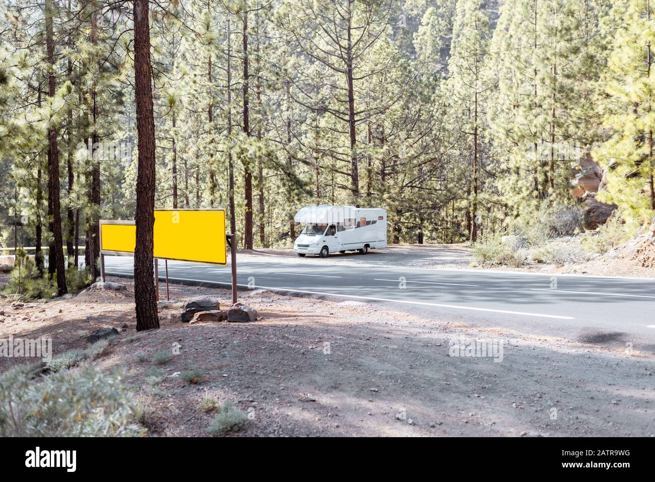 Camping car on the roadside in the mountain pine forest Stock Photo - Alamy