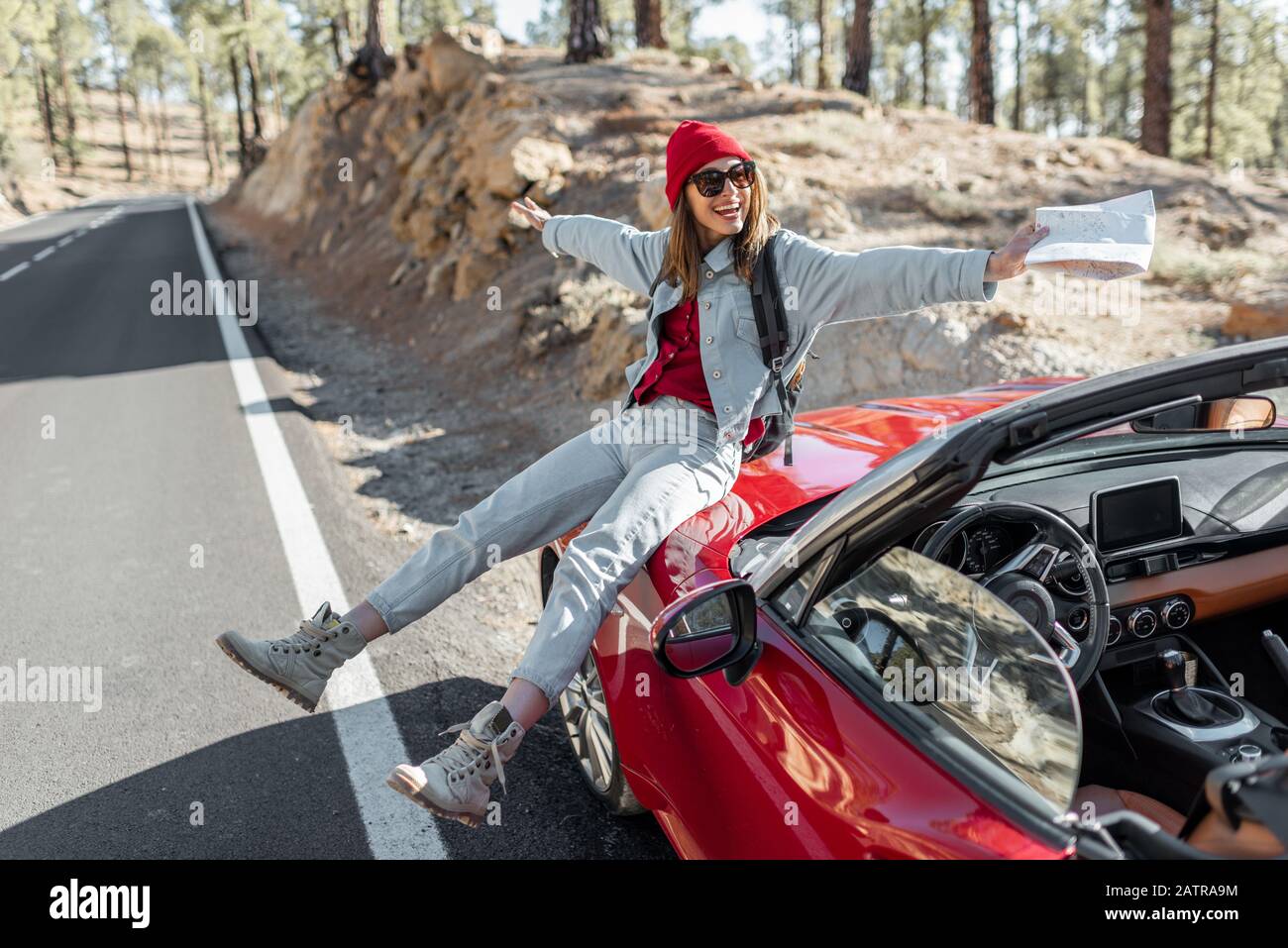 Woman sitting on car hood hi res stock photography and images Alamy