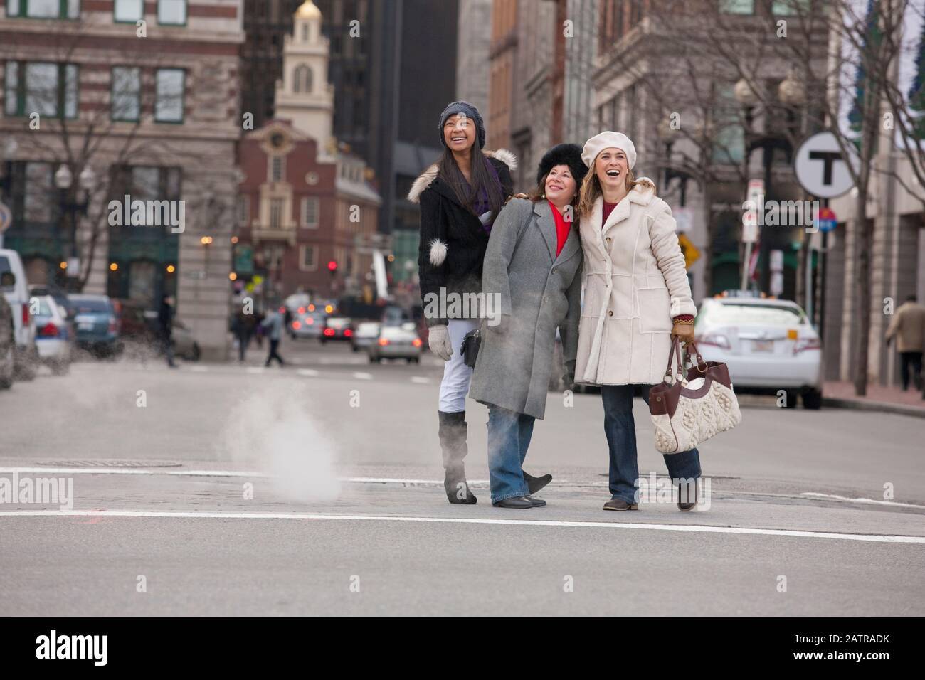 Three women standing on a city street; Boston, Massachusetts, United ...