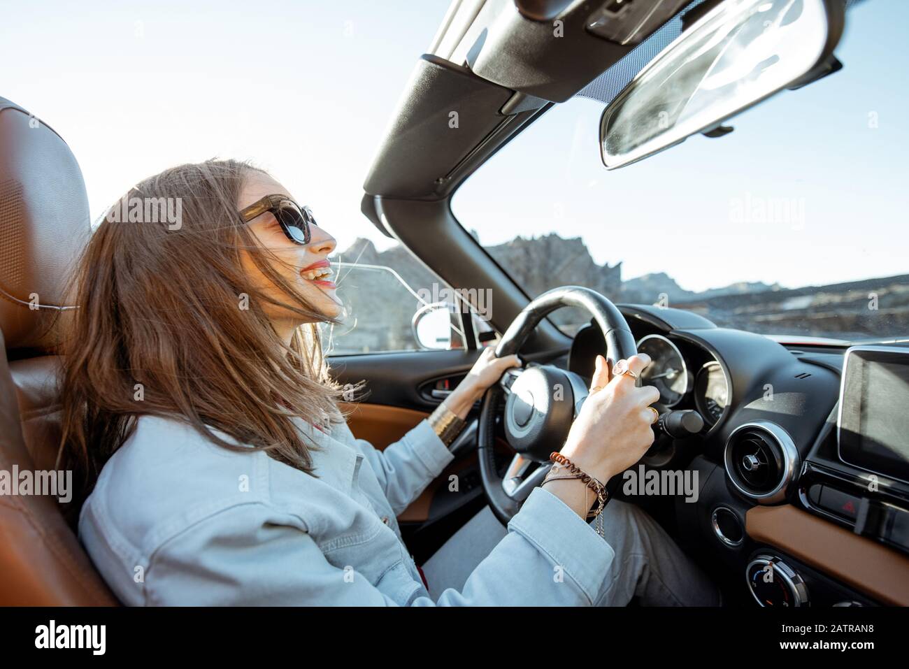 Driving convertible wind hair hi-res stock photography and images - Alamy