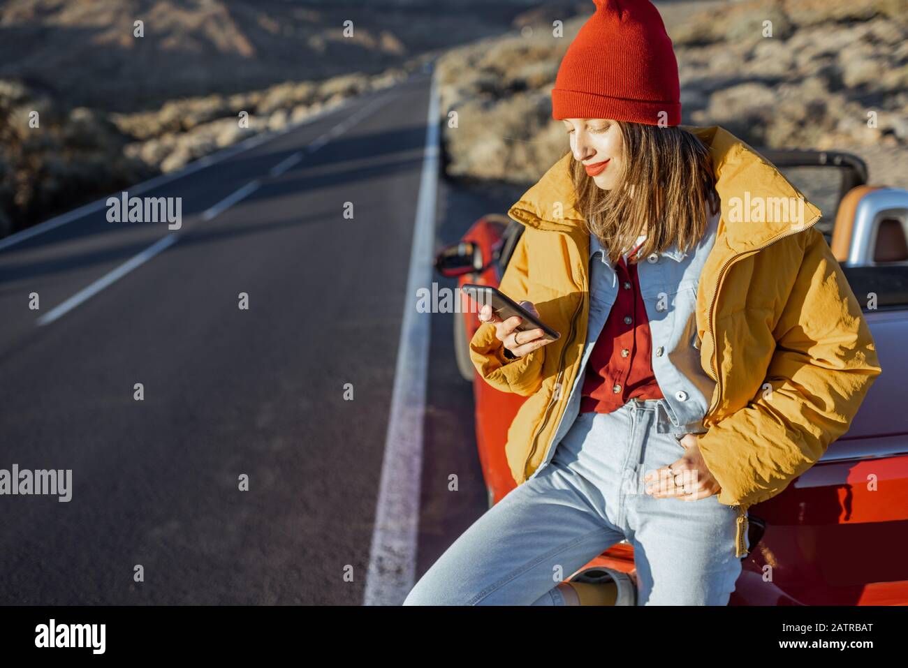 Woman in yellow jacket hi-res stock photography and images - Alamy
