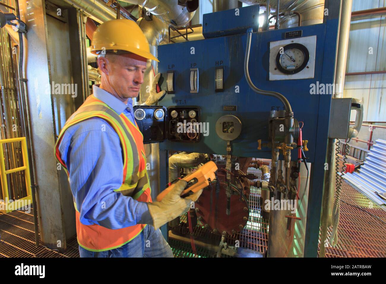 Worker wearing hard hat using hi-res stock photography and images - Alamy