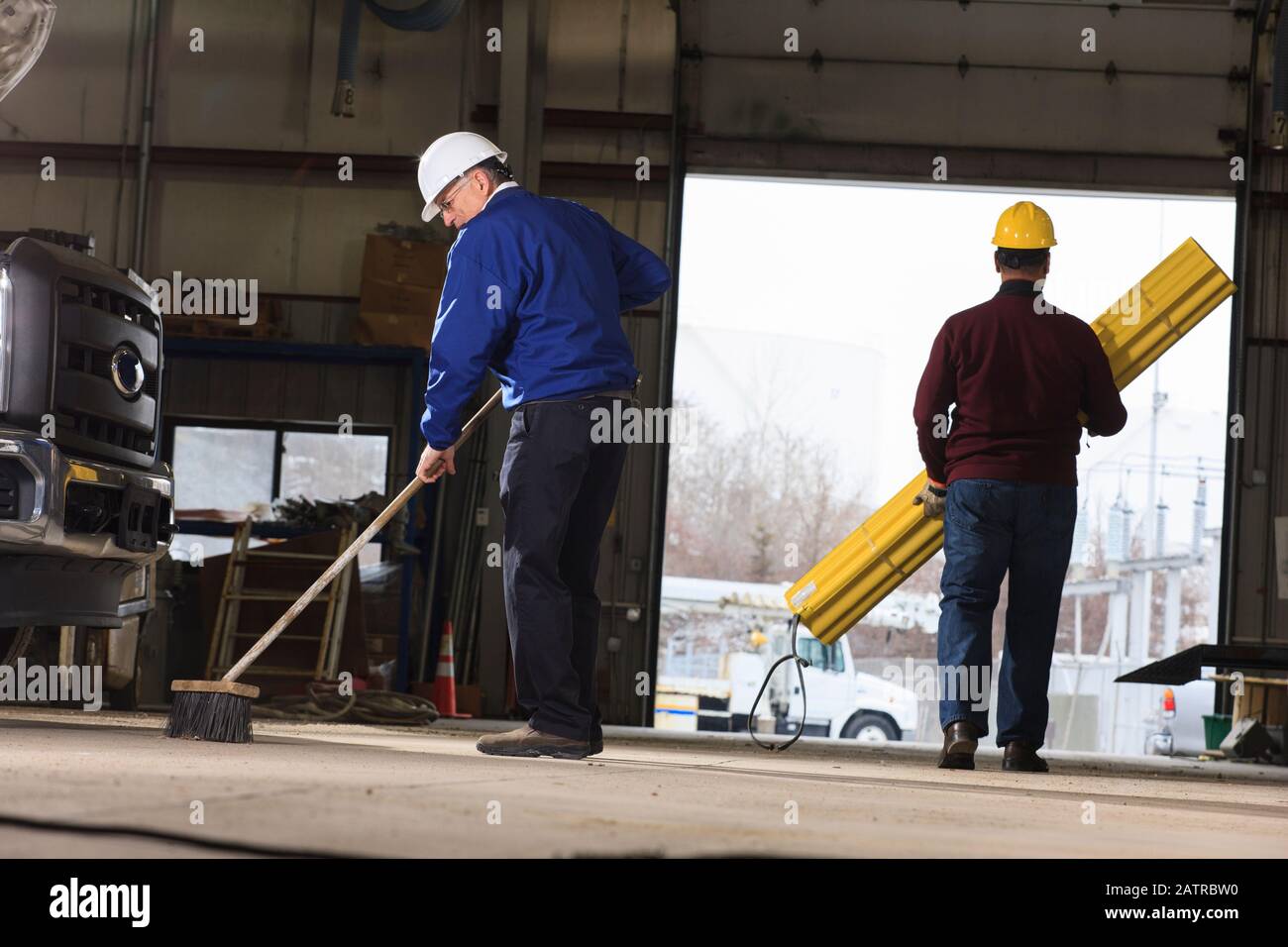 Worker sweeping hi-res stock photography and images - Alamy