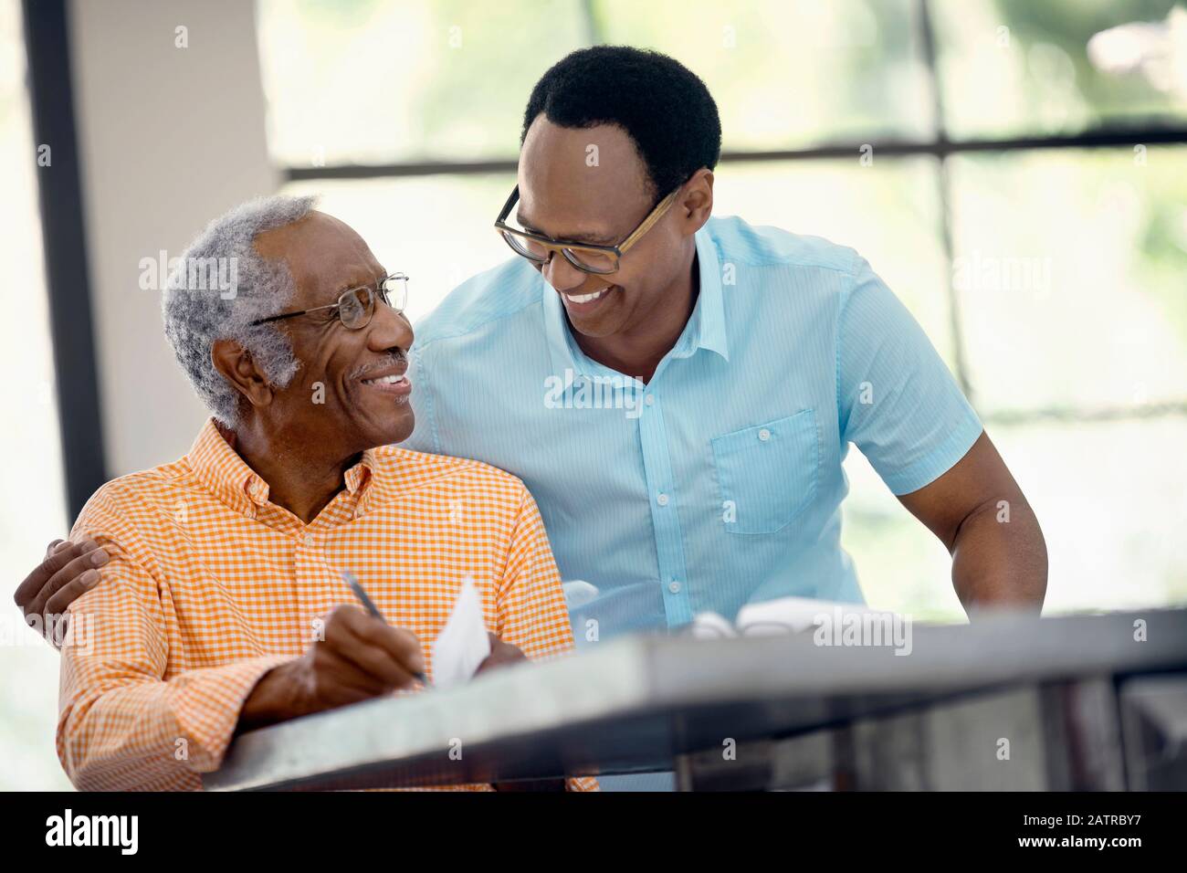 A man and his father sharing a special moment Stock Photo - Alamy