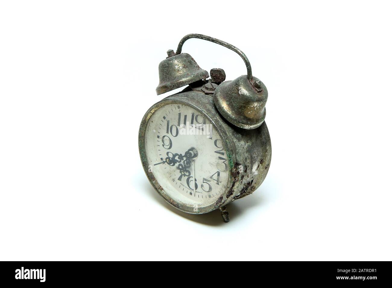 The old retro alarm clock with bit of rust and patina isolated in a ...