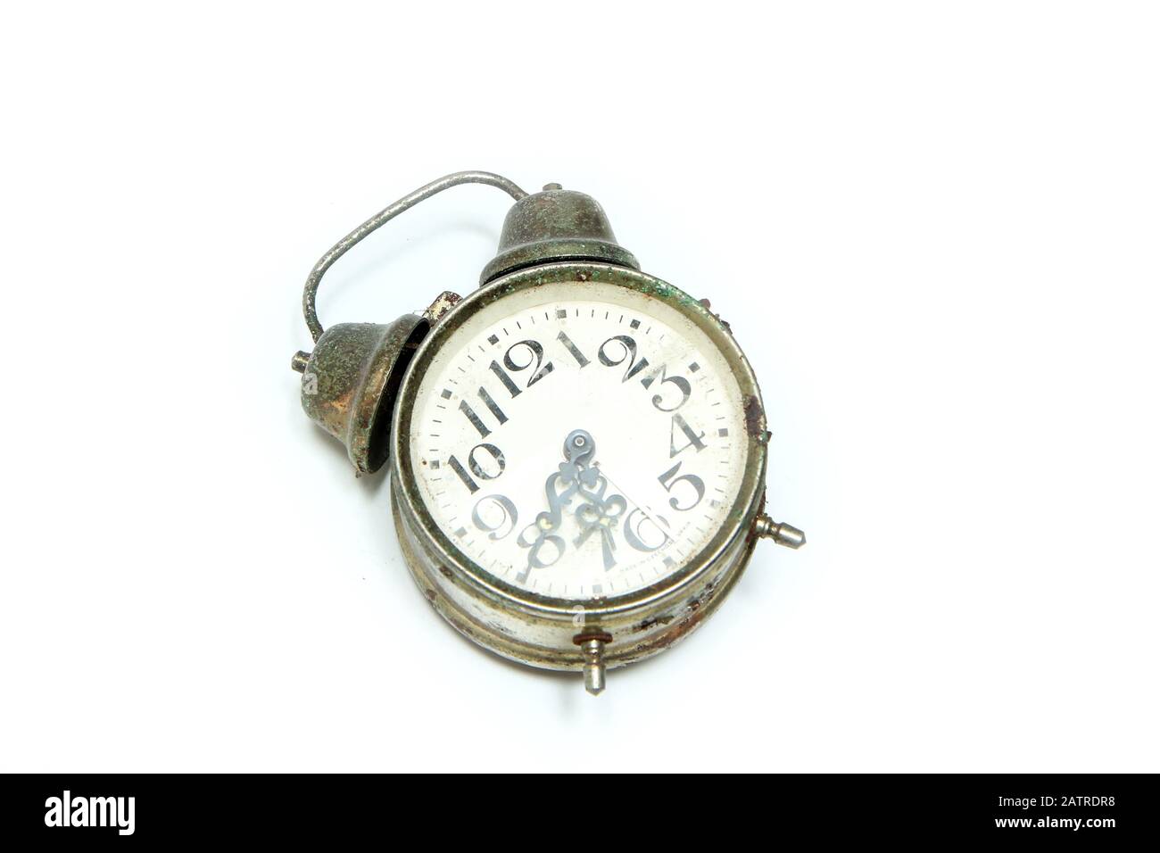 The old retro alarm clock with bit of rust and patina isolated in a ...