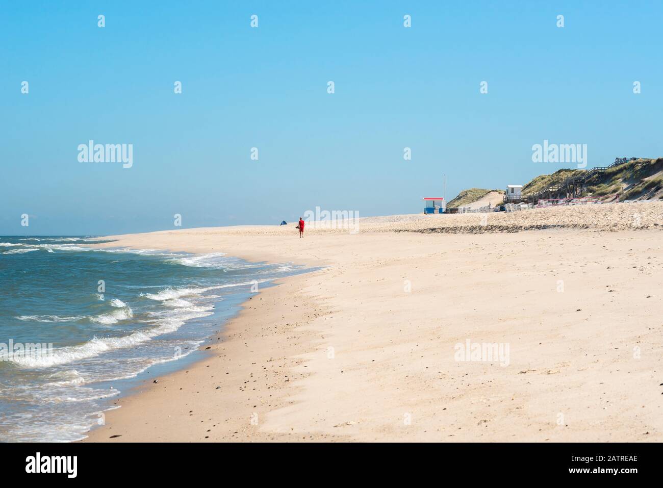Beach scenery with fine sand and blue water, on sunny summer day, on ...