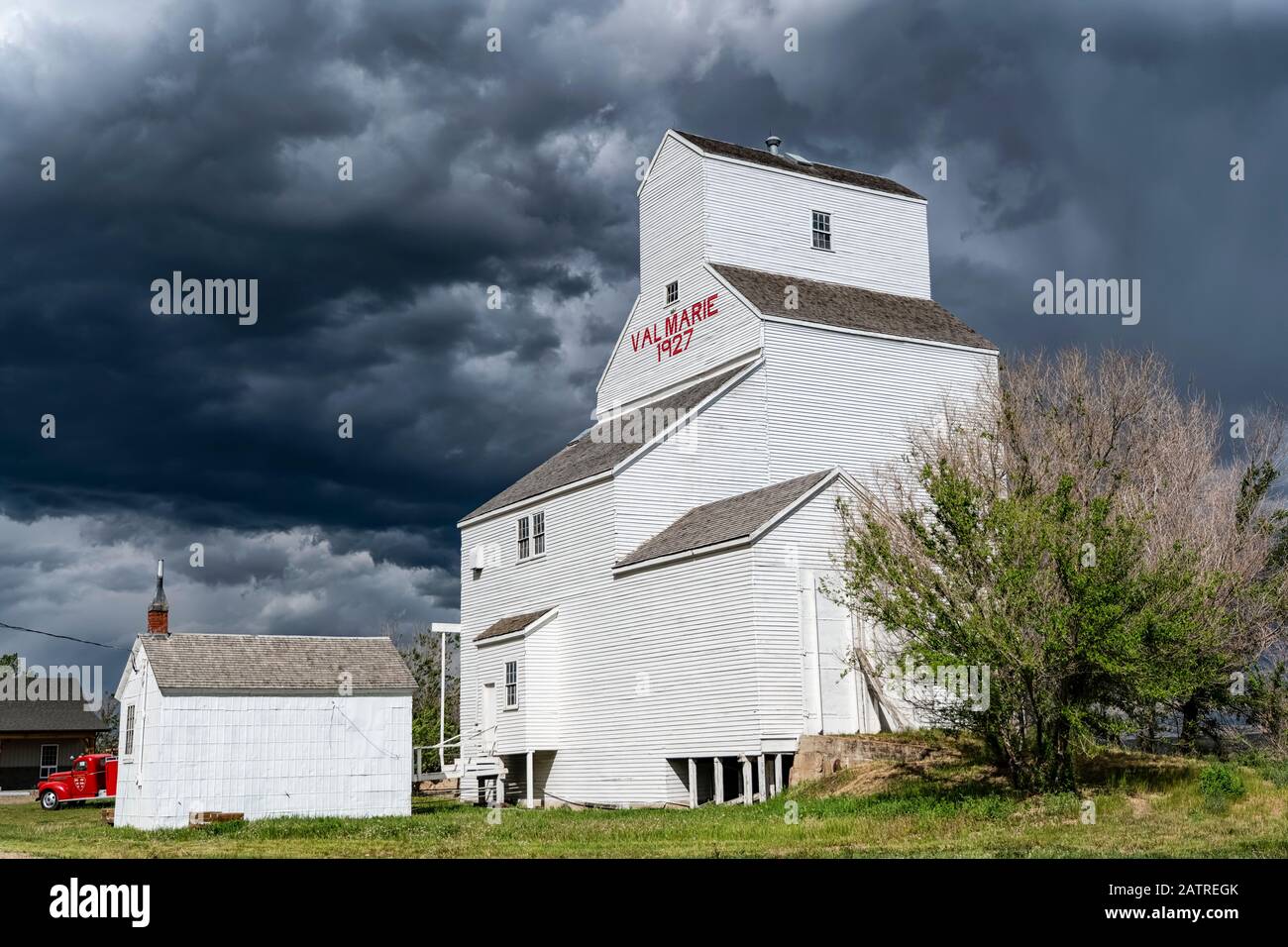 White grain elevator in Val Marie under dramatic storm clouds; Val ...
