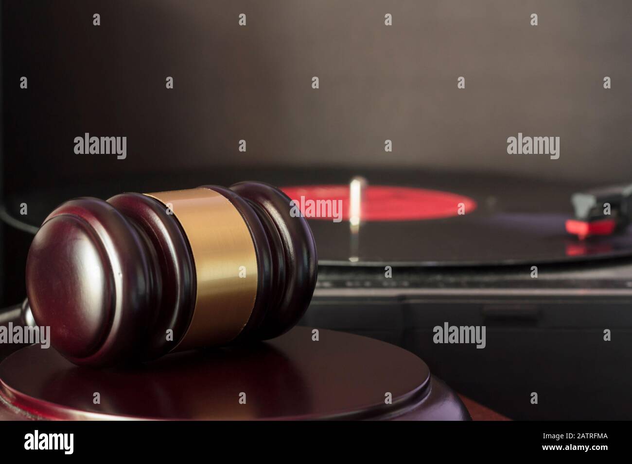 Judge's gavel and vinyl record player. Concept of entertainment lawsuit ...