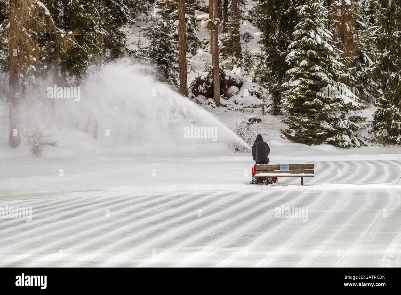 man using snow blower to remove snow Stock Photo - Alamy