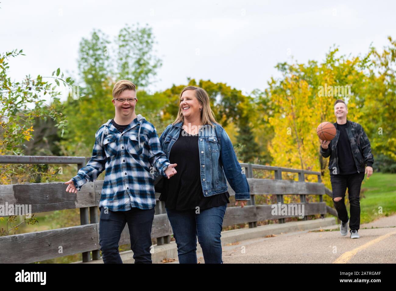 Down syndrome family walking park hi-res stock photography and images ...