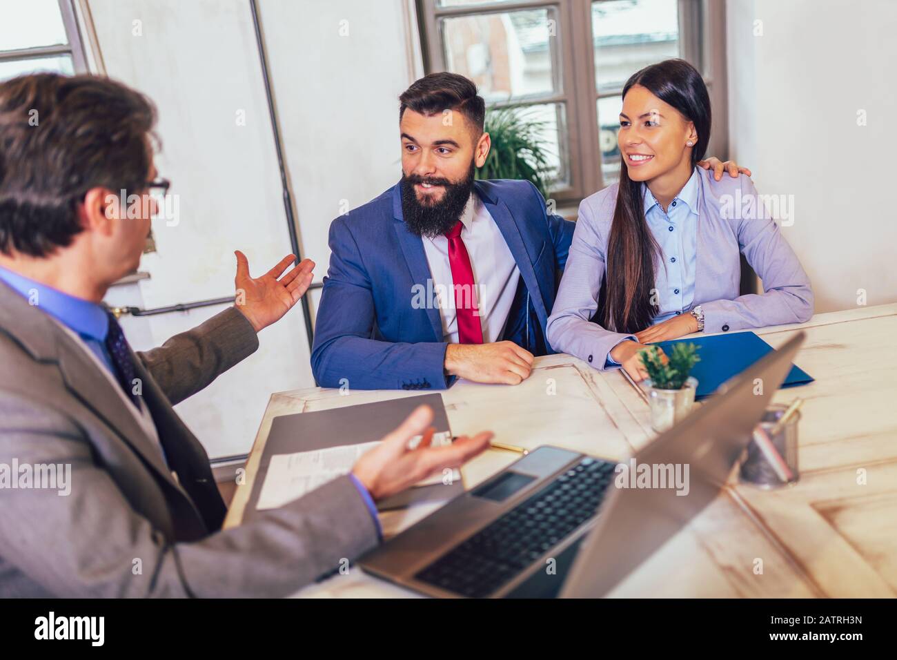 Bank manager sitting with family hi-res stock photography and images ...